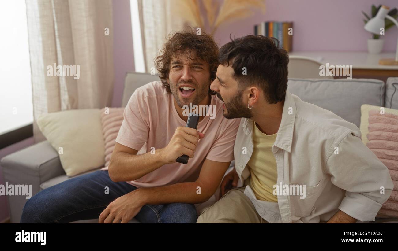 Two men singing together in a living room, enjoying a fun bonding ...