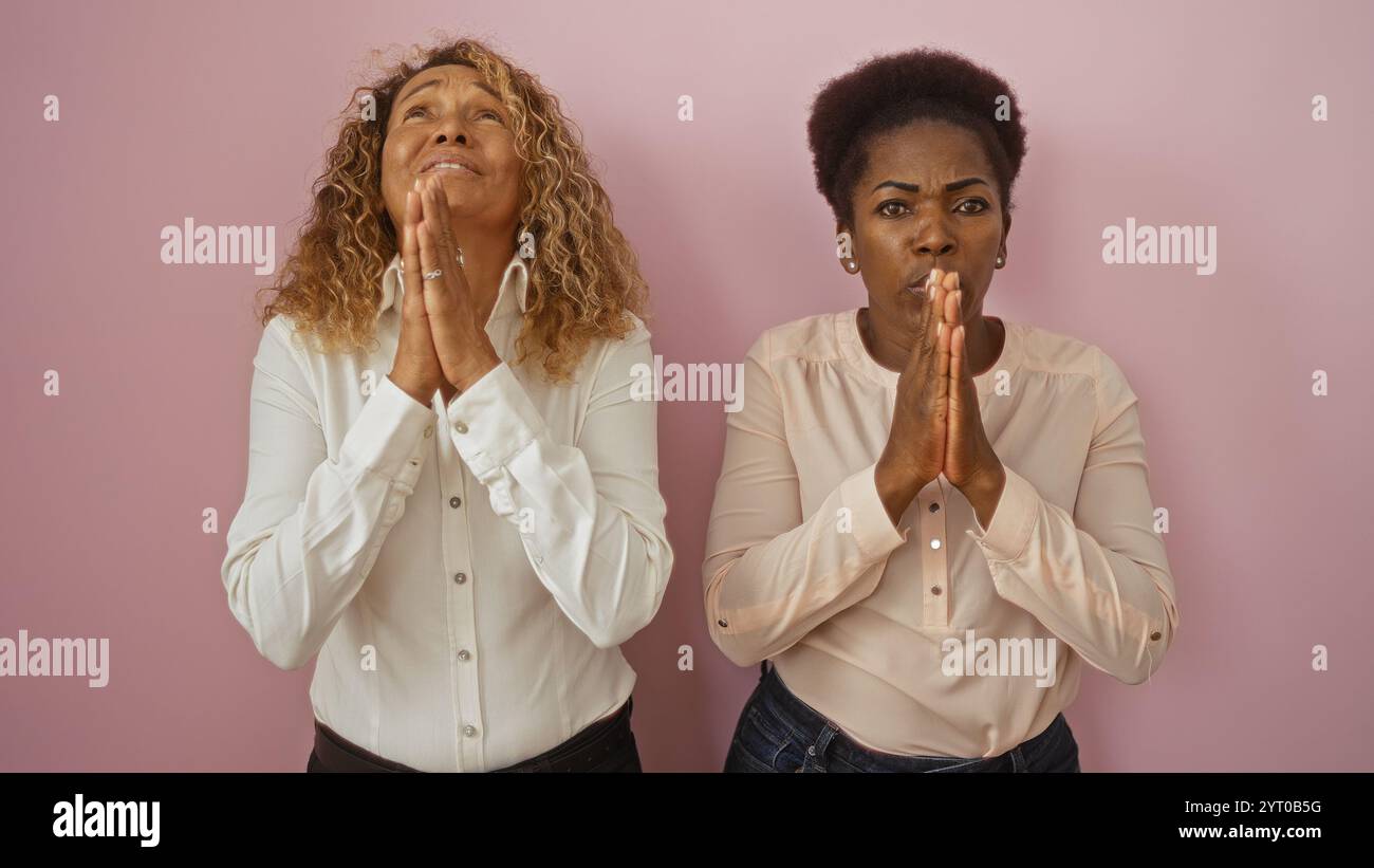 Women praying together quietly over a pink background with peaceful ...