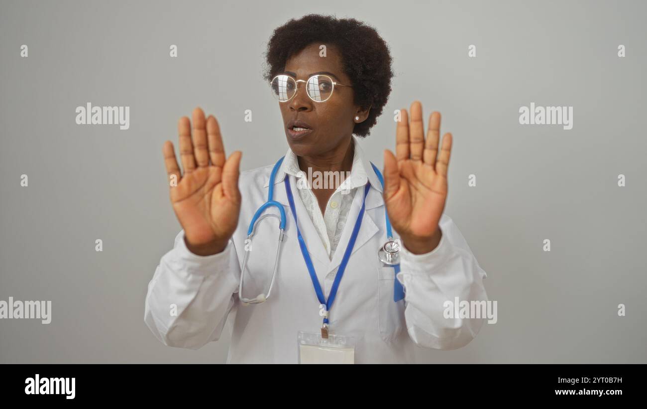 African american female doctor with curly hair and glasses makes a stop ...