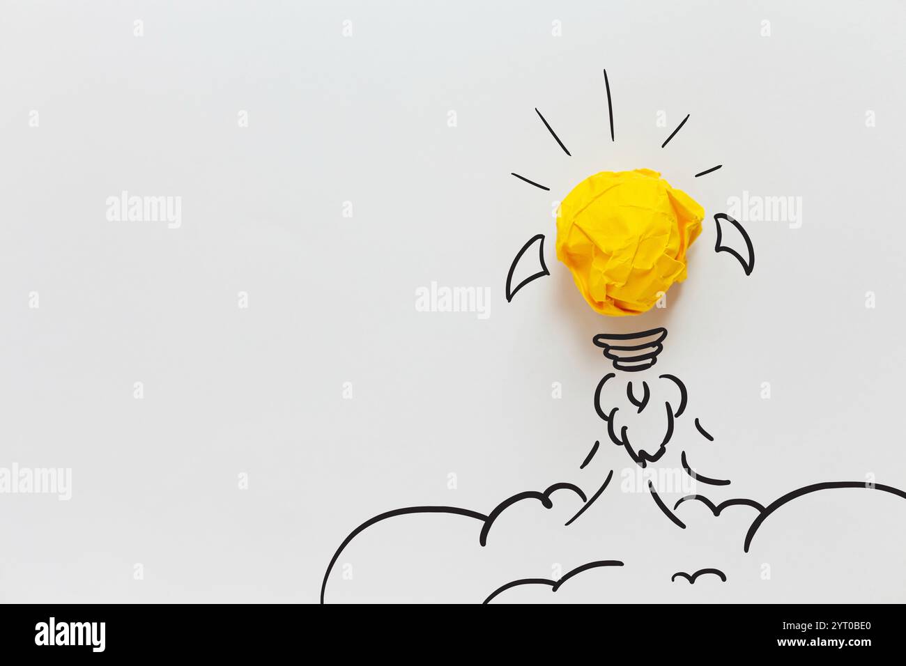Idea light bulb crumpled yellow paper ship take off to the sky like a ...