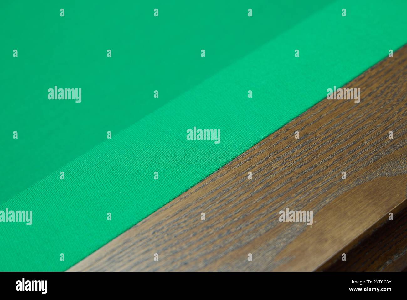 A Green Felt Pool Table Surface Featuring a Beautiful Wooden Edge for ...