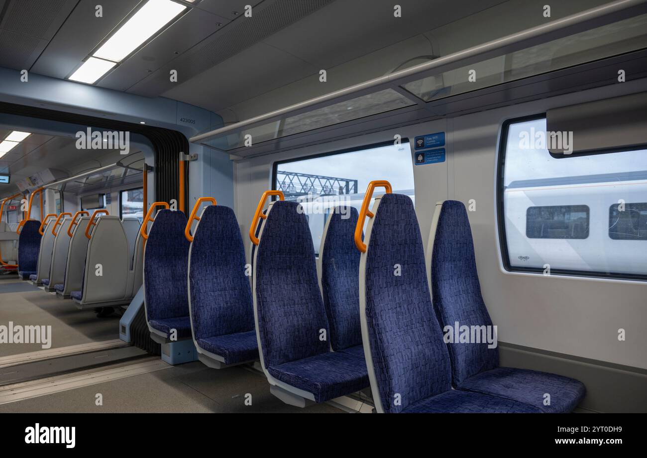 Empty carriage interior of Southeastern commuter train leaving London Bridge station eastbound ...