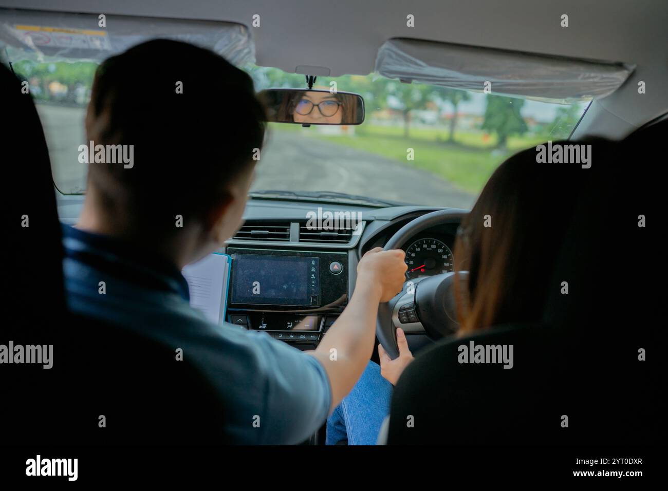 Driving Lesson Providing Instructions and Guidance to a Student Behind ...