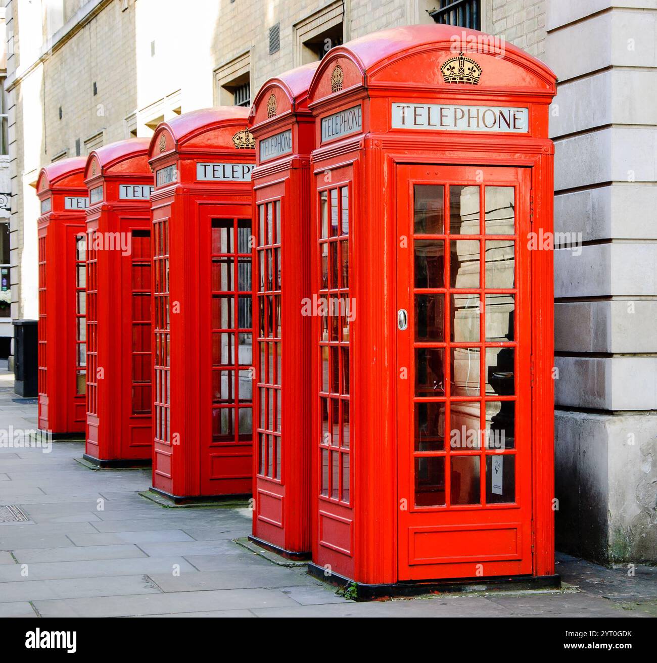 Five traditional old style red phone boxes in London, England, UK Stock ...