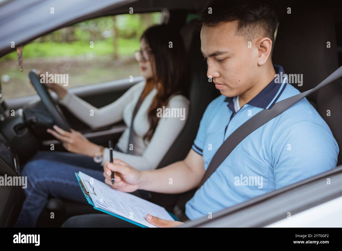 The instructor observes the student driving to ensure proper technique ...