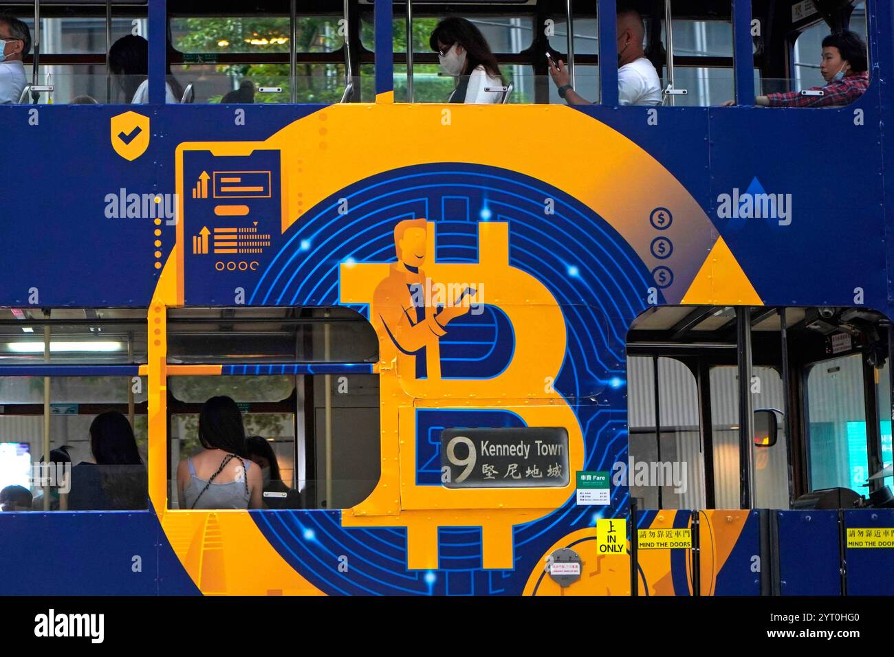 FILE - An advertisement for the cryptocurrency Bitcoin displayed on a ...