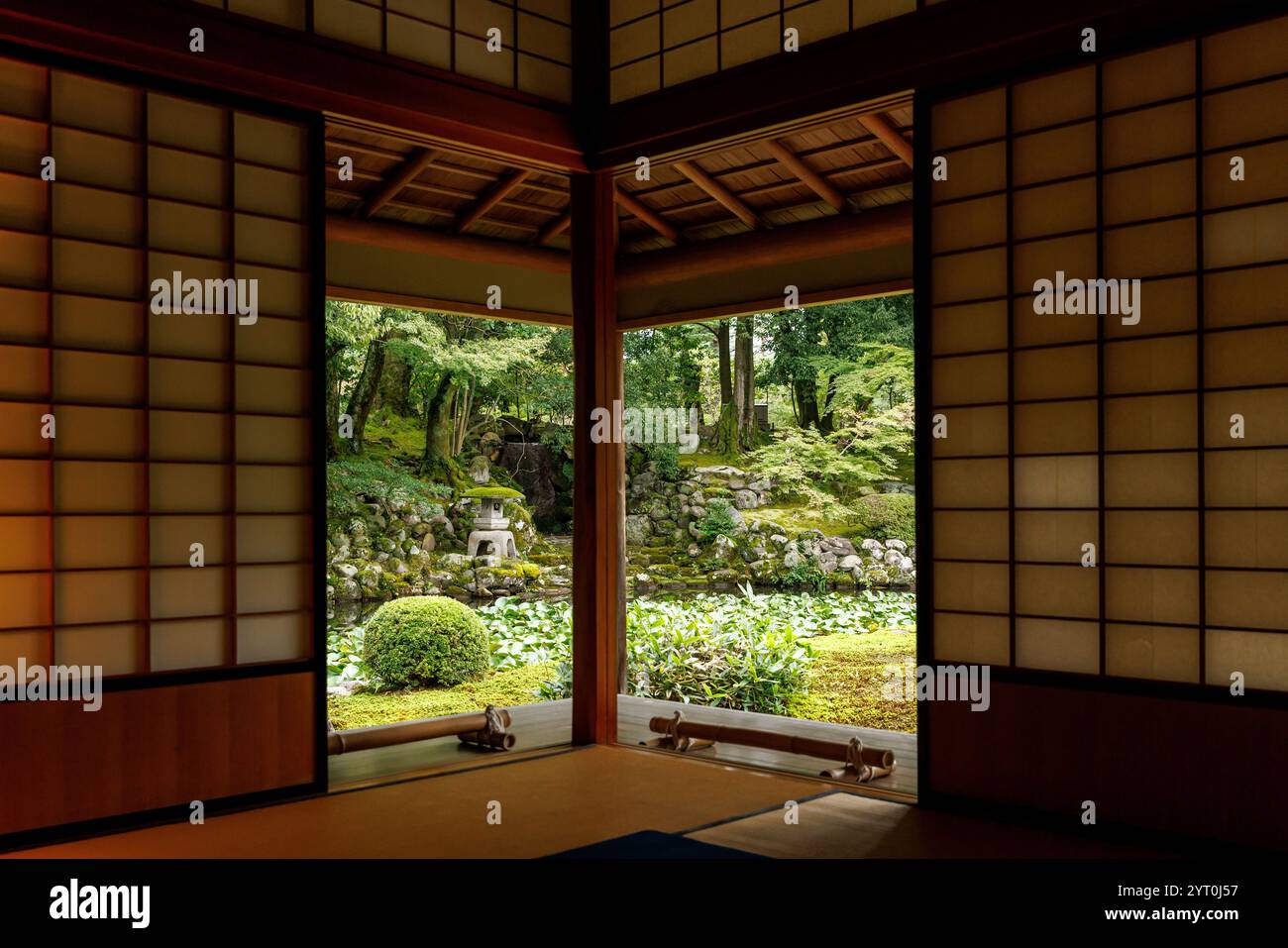 Traditional Japanese room with shoji screens and tatami mats with ...