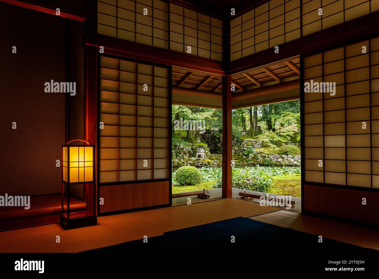 Traditional Japanese room with shoji screens and tatami mats with ...