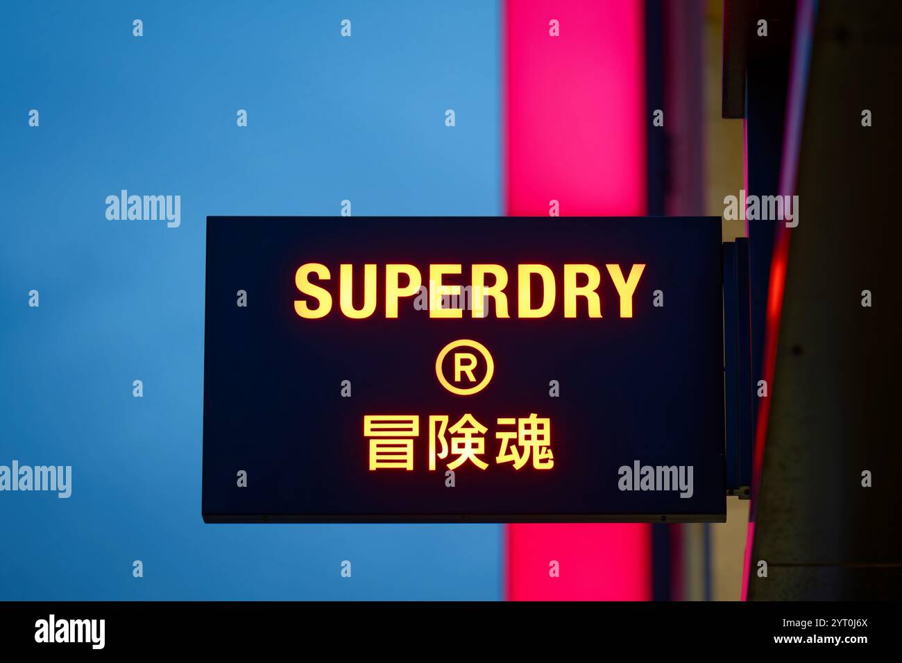 Cologne, Germany, December 04 2024: illuminated SUPERDRY advertising ...