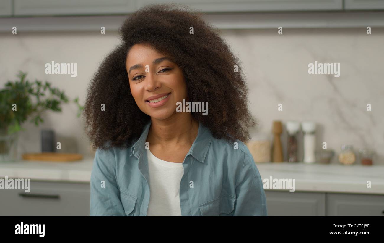 Portrait happy smiling positive African American woman housewife ...