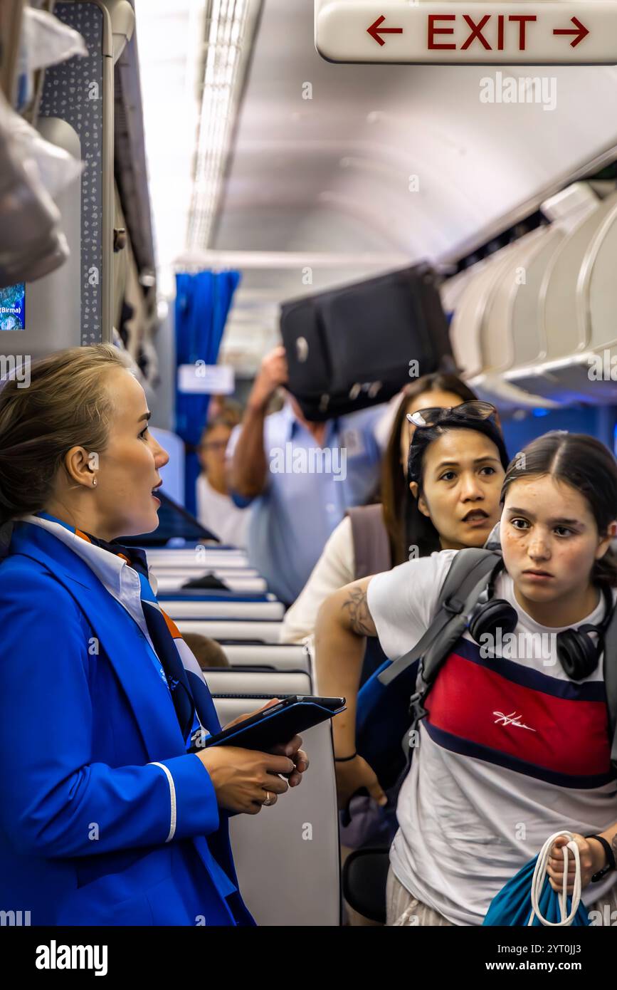 Cabin crew and passengers on board KLM flight from Amsterdam Stock ...