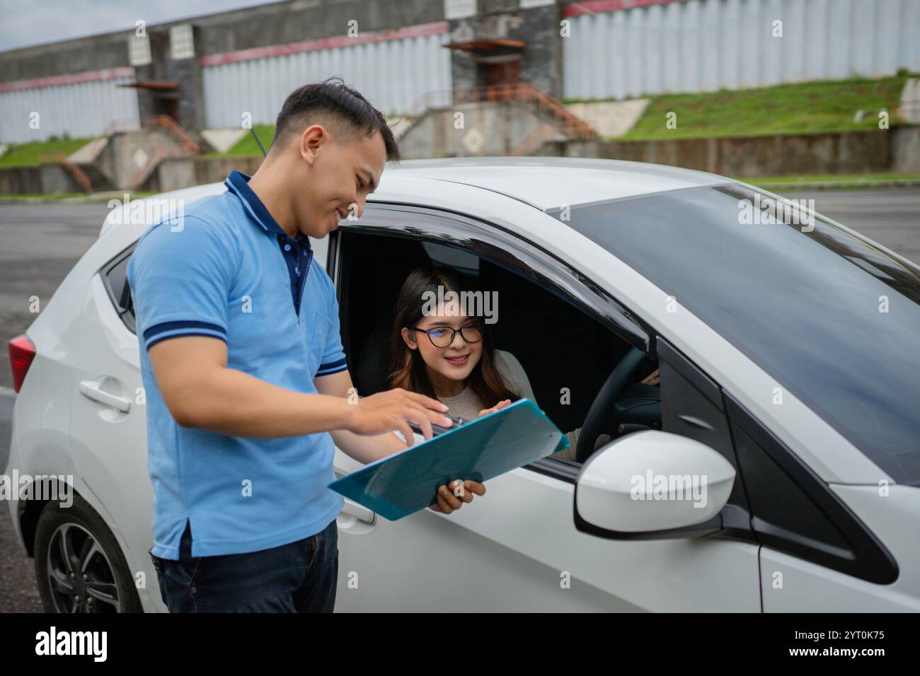 Driving Instruction Instructor Guiding Student Behind the Wheel for ...