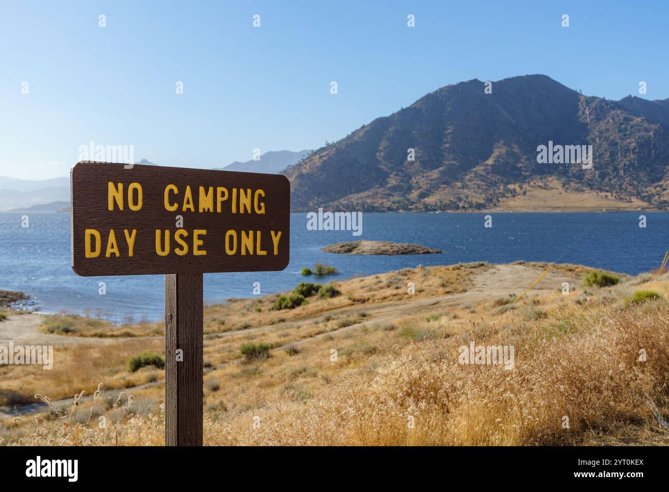 A brown sign reading "NO CAMPING DAY USE ONLY" is prominently displayed ...