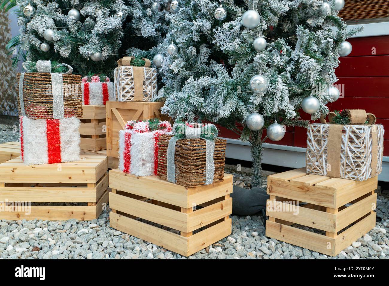 present boxes and Christmas tree in the outdoor at horizontal ...