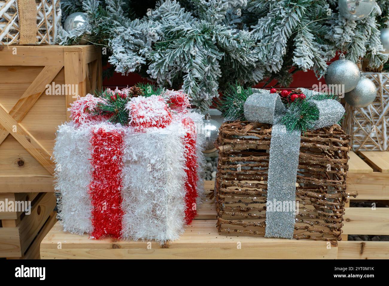 present boxes and Christmas tree in the outdoor at horizontal ...
