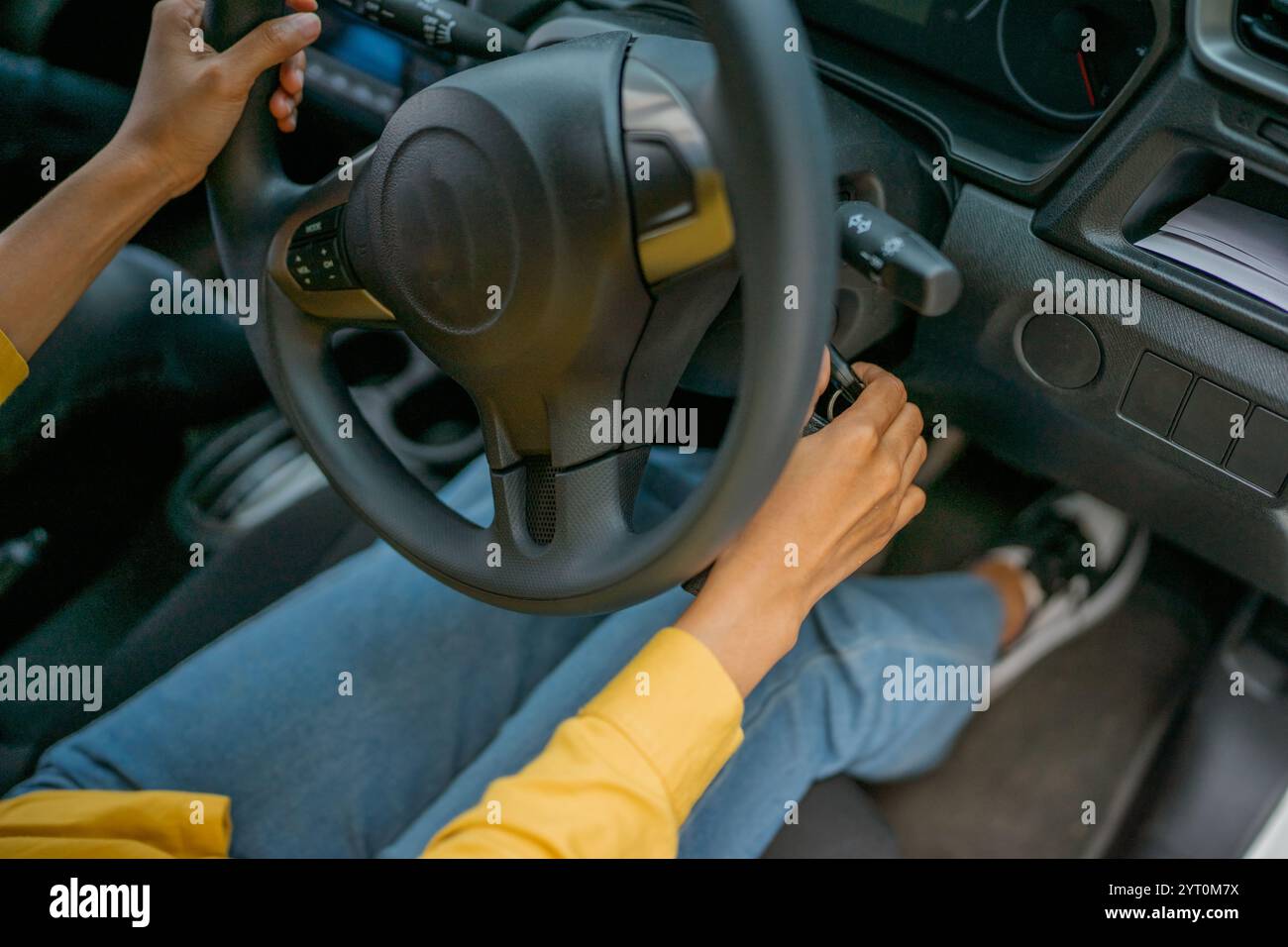 A Focused Driver Carefully Adjusting the Controls Inside a Modern ...