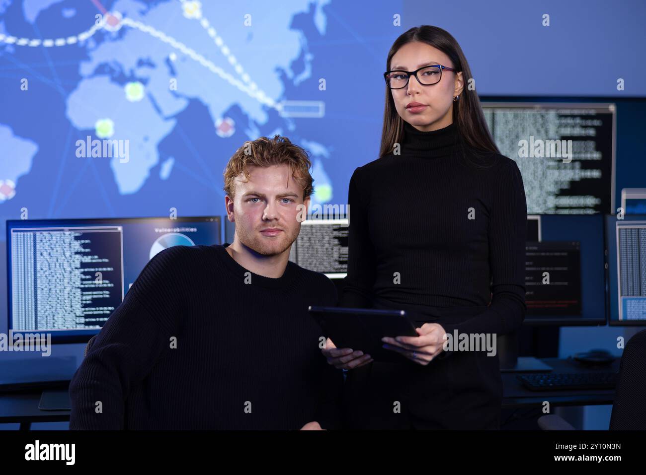 Professional serious cyber security team in front of cybersecurity SIEM ...