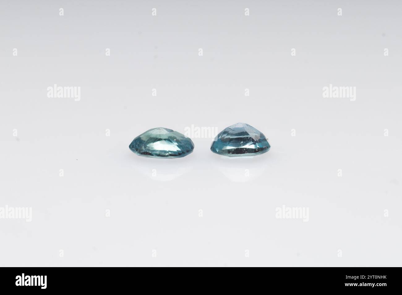 Sparkling Blue Gemstones on a Smooth White Surface Stock Photo - Alamy