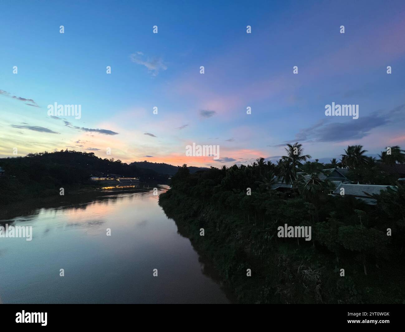Sunset river scene Luangprabang Stock Photo - Alamy