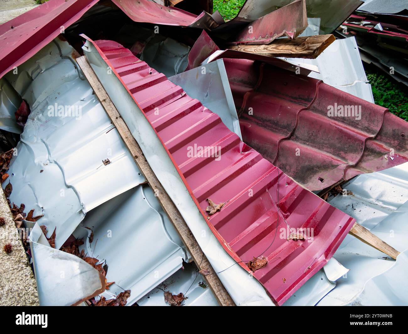 Pieces of corrugated sheets and metal tiles from a broken roof Stock ...