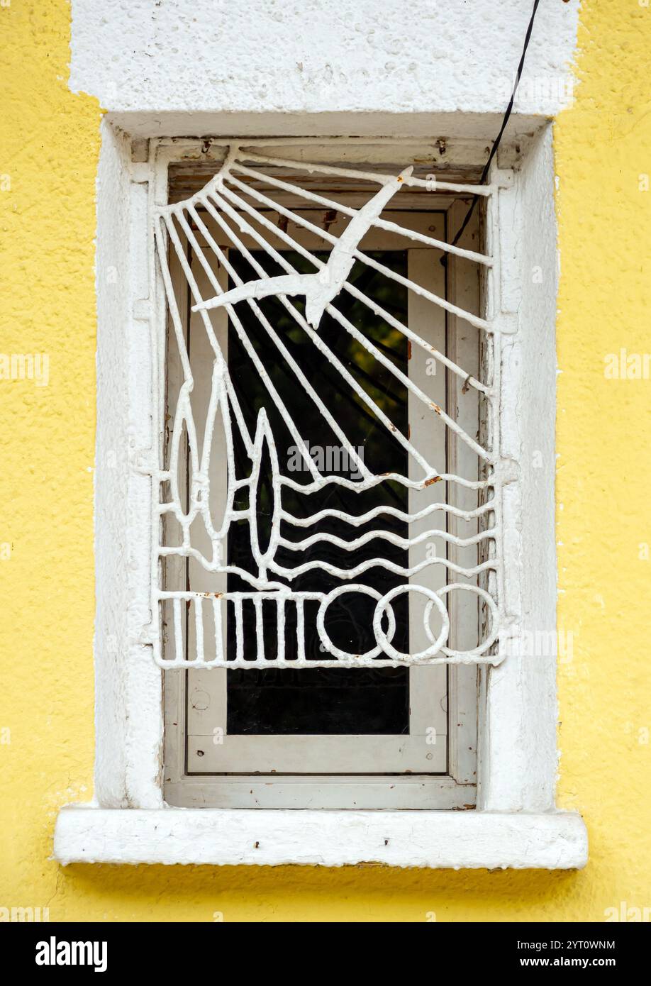 Decorative metal rod grille sea image on old window Stock Photo - Alamy