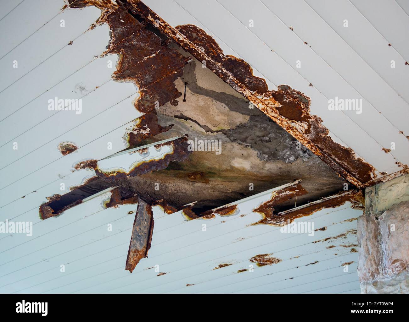 Rotten ceiling lining made of metal profile Stock Photo - Alamy