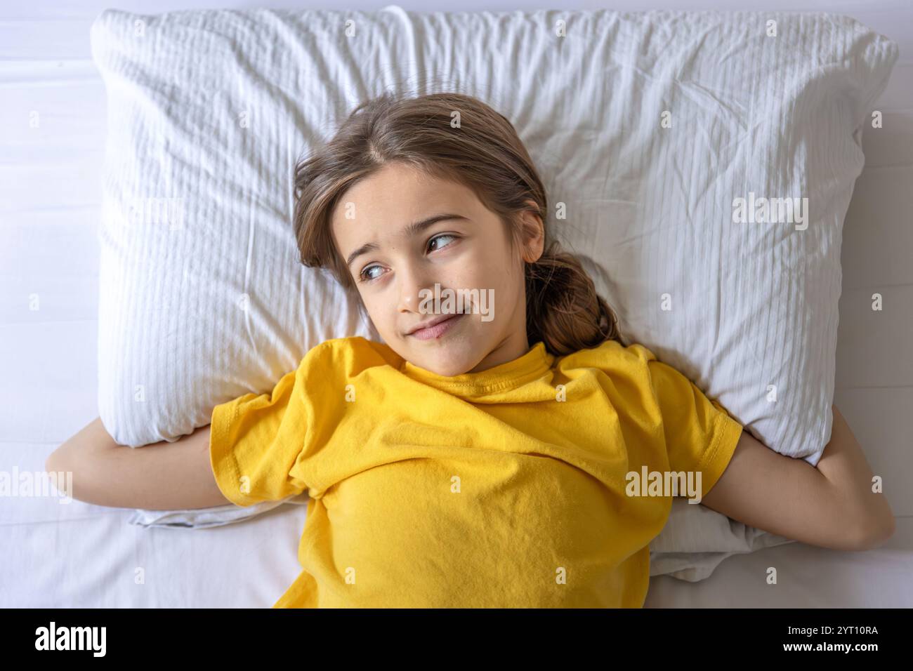 Happy and smiling girl in bed. Top view. Emotions concept Stock Photo ...