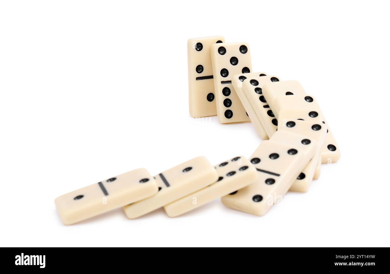 Domino effect. Tiles falling on white background Stock Photo - Alamy