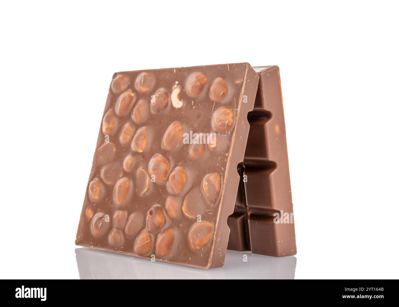 Two bars of dark chocolate with hazelnuts, close-up, isolated on a ...