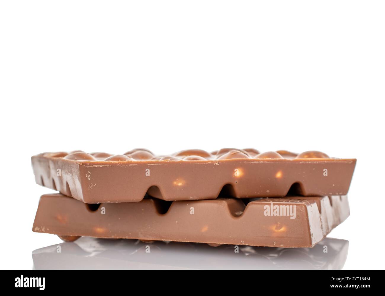 Two bars of dark chocolate with hazelnuts, close-up, isolated on a ...