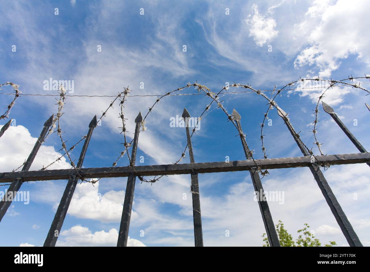 the barbed wire fence of protected prison territory. High quality photo ...