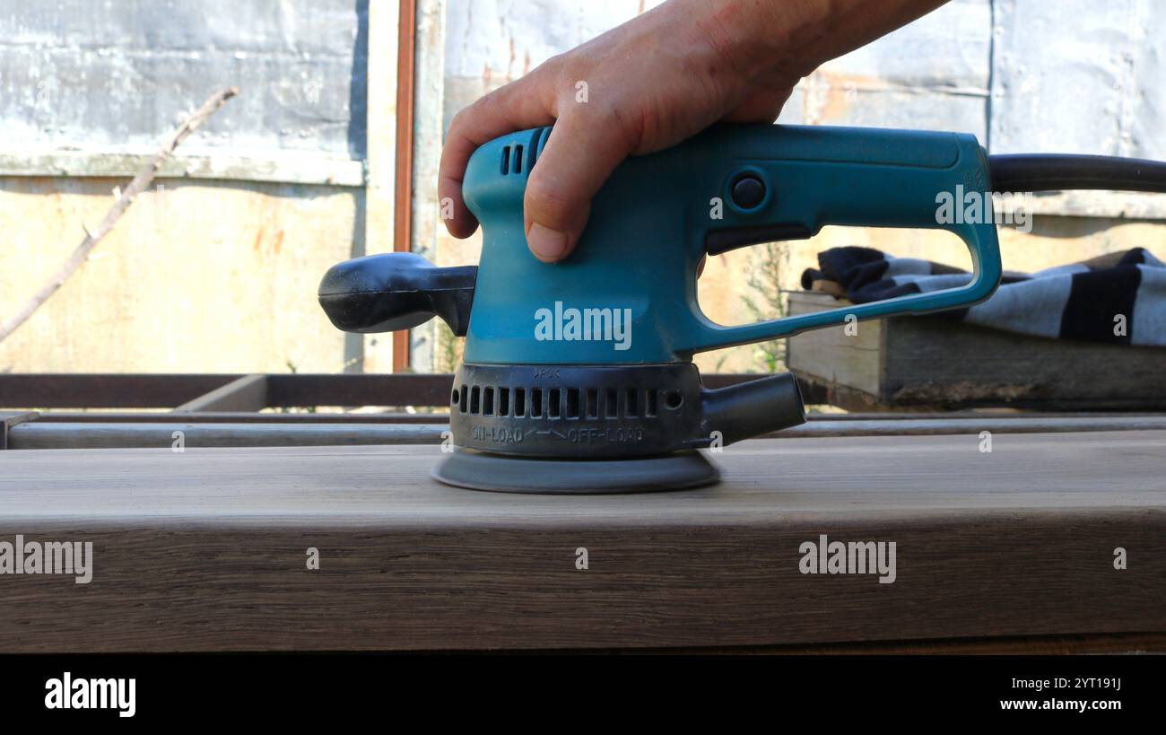 Joiner sanding wood board close hi-res stock photography and images - Alamy