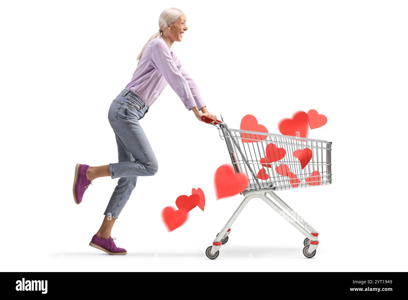 Tall slim woman running with a shopping cart full of hearts isolated on ...