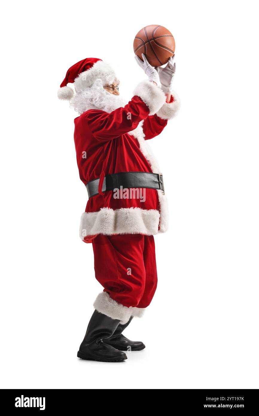 Santa Claus playing basketball isolated on white background Stock Photo ...