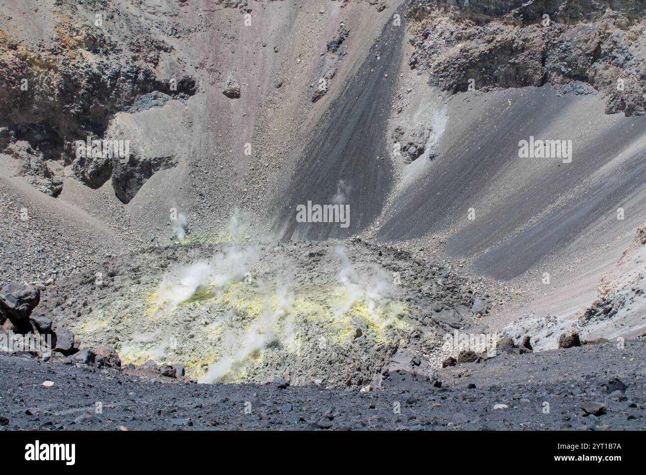 Volcano crater inside. Lava, ash, smoke and rocks inside of volcano ...