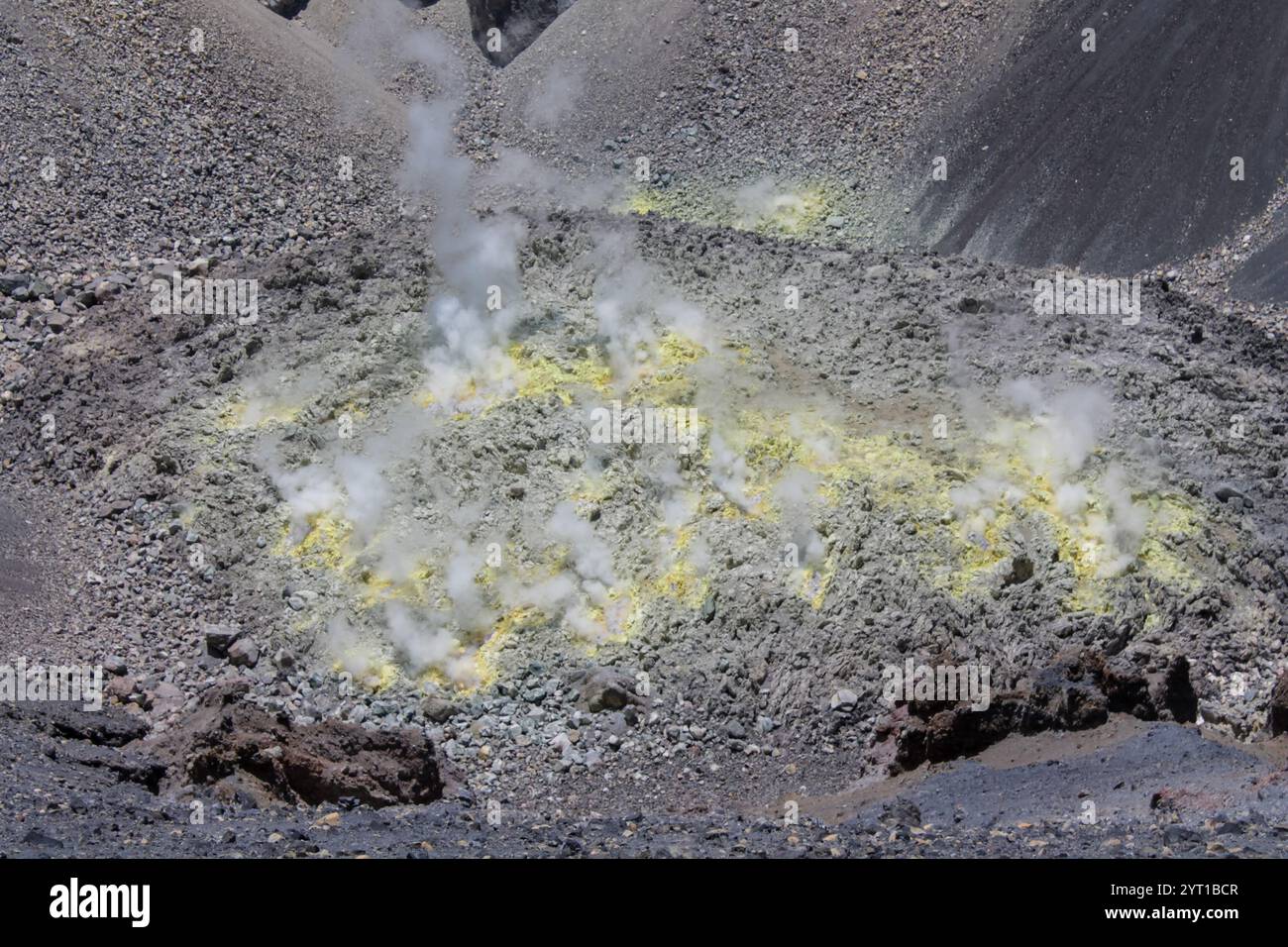 Volcano crater inside. Lava, ash, smoke and rocks inside of volcano ...