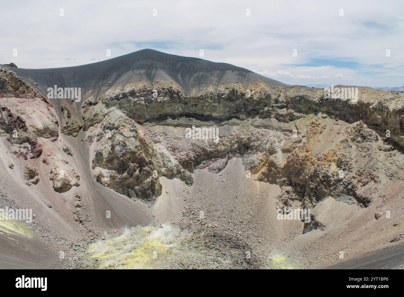 Volcano crater inside. Lava, ash, smoke and rocks inside of volcano ...