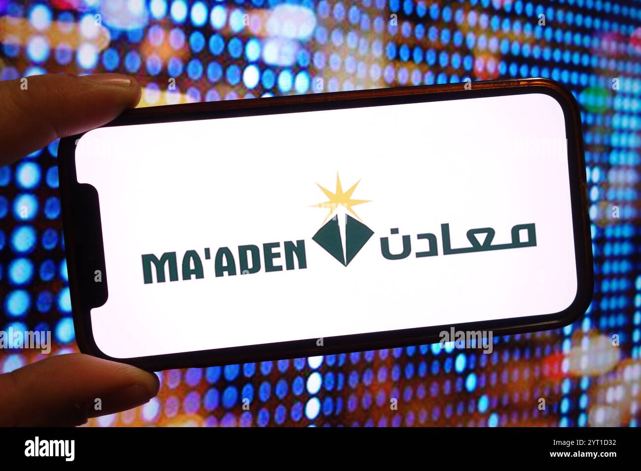 In this photo illustration, the Maaden company logo is seen displayed on a smartphone screen ...