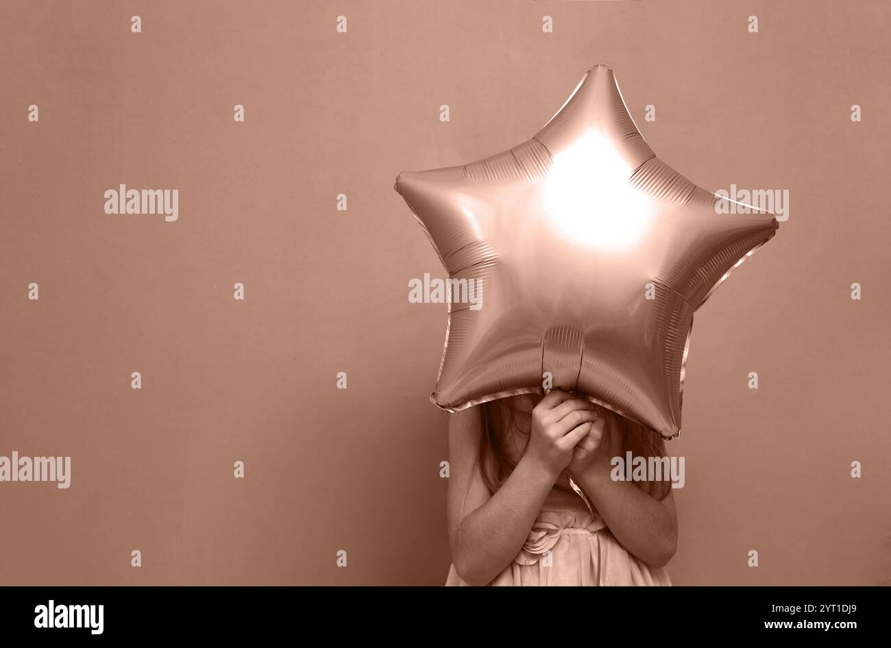 Color of the year 2025 Mocha Mousse. An unrecognisable girl stands and ...