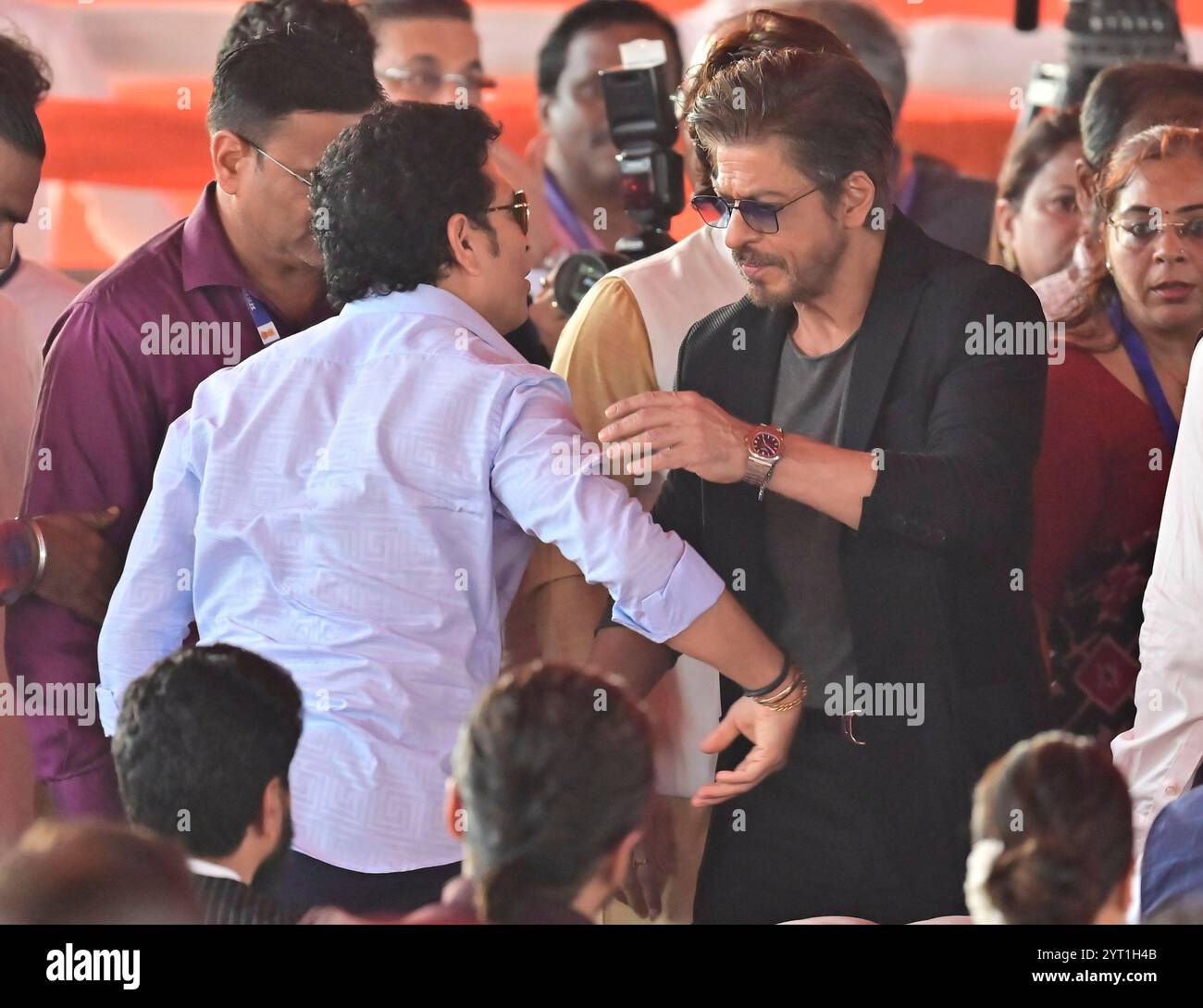 MUMBAI, INDIA - DECEMBER 5: Shahrukh Khan shares light moment with Sachin Tendulkar, during the ...