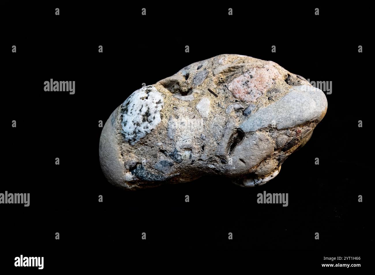Conglomerate formation with pebbles and breccias in sand, silt, and ...