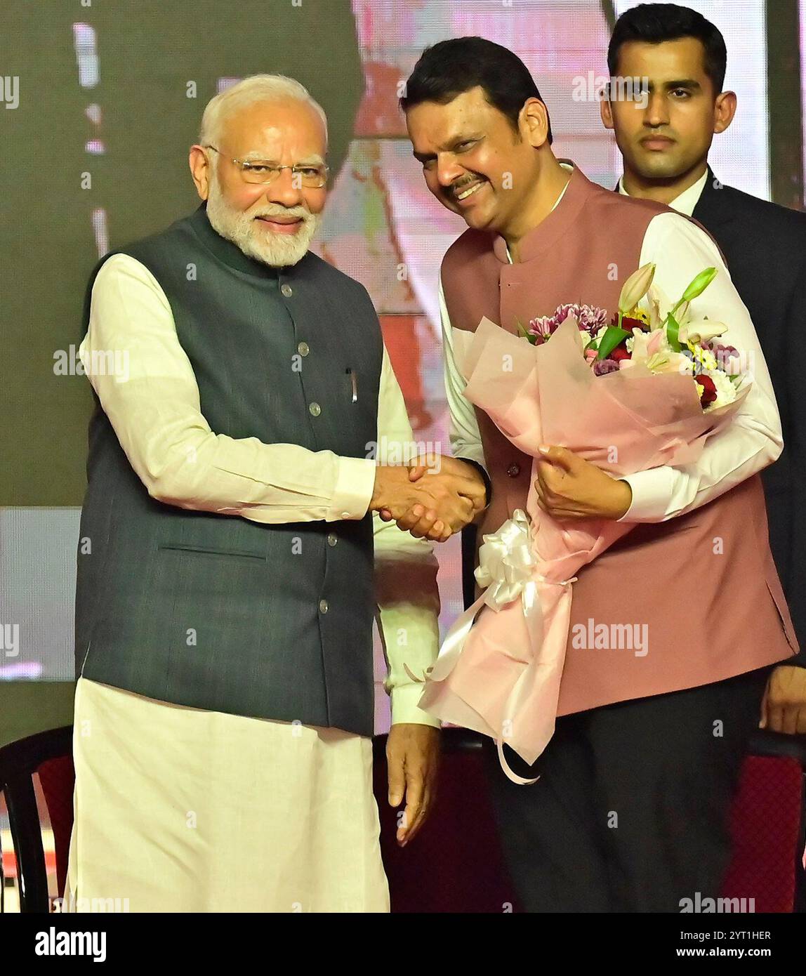 MUMBAI, INDIA - DECEMBER 5: PM Narendra Modi shares light moment with newly appointed CM ...