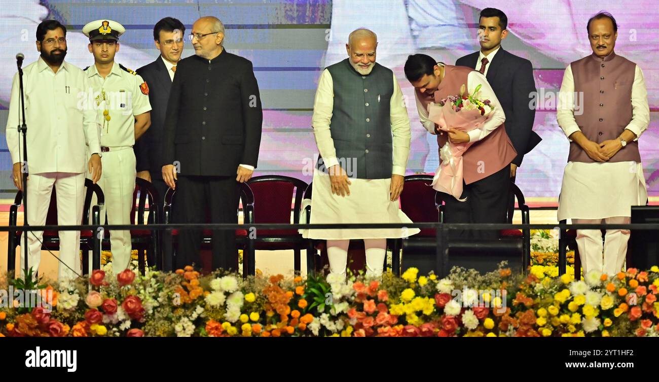 MUMBAI, INDIA - DECEMBER 5: PM Narendra Modi shares light moment with newly appointed CM ...