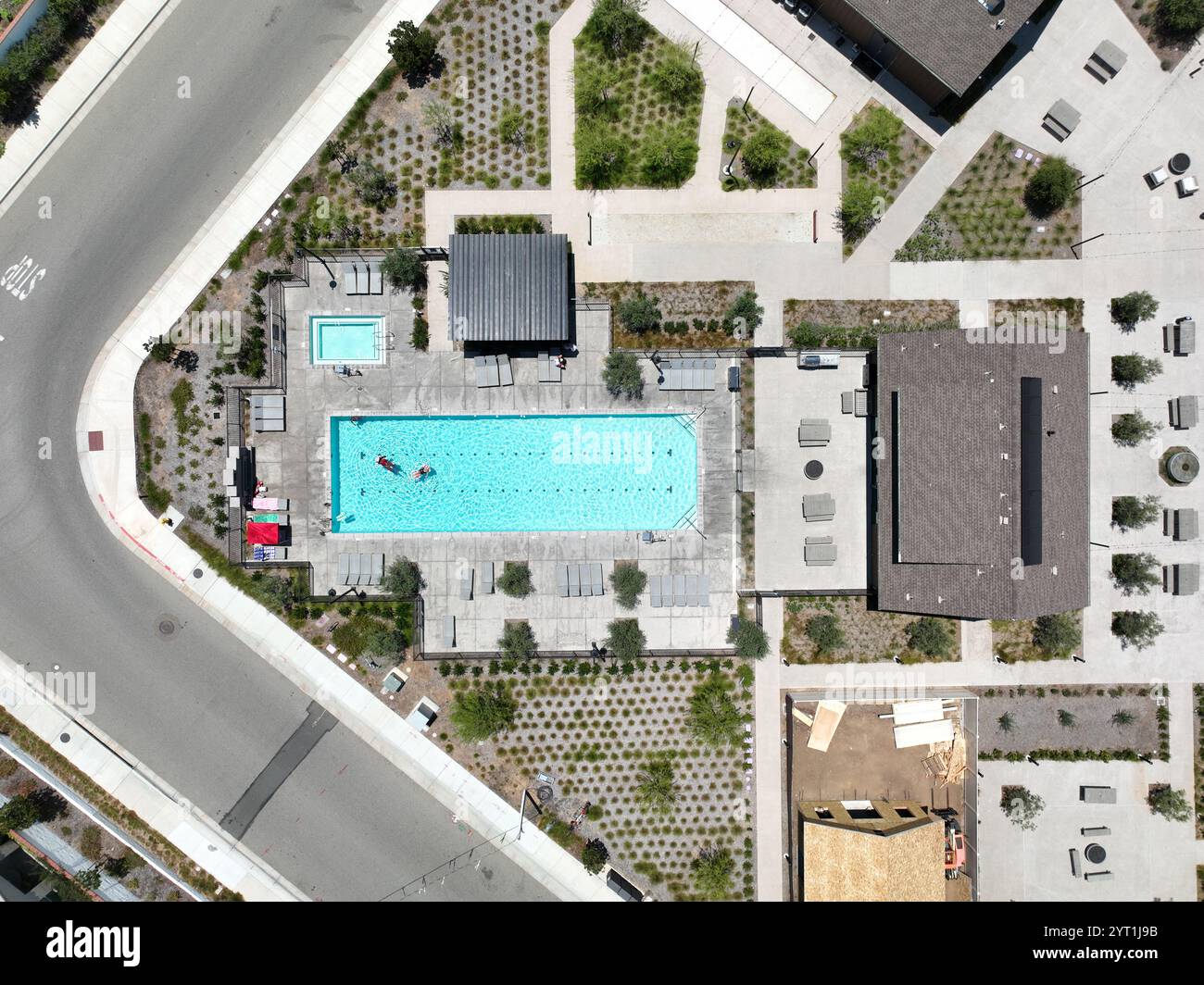 Aerial video of recreational facilities with pool in private ...