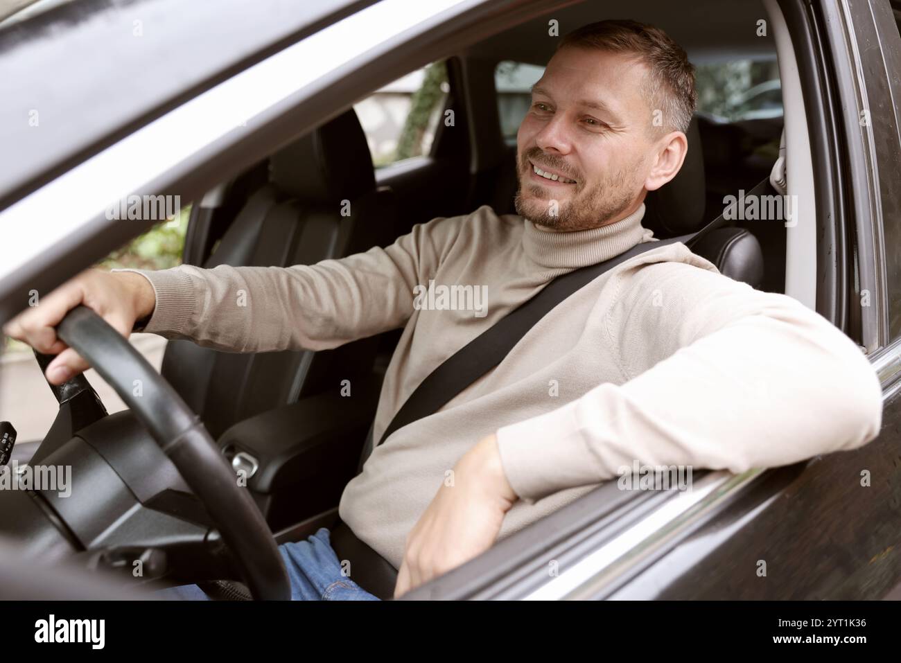 Man driving modern car, view through window Stock Photo - Alamy