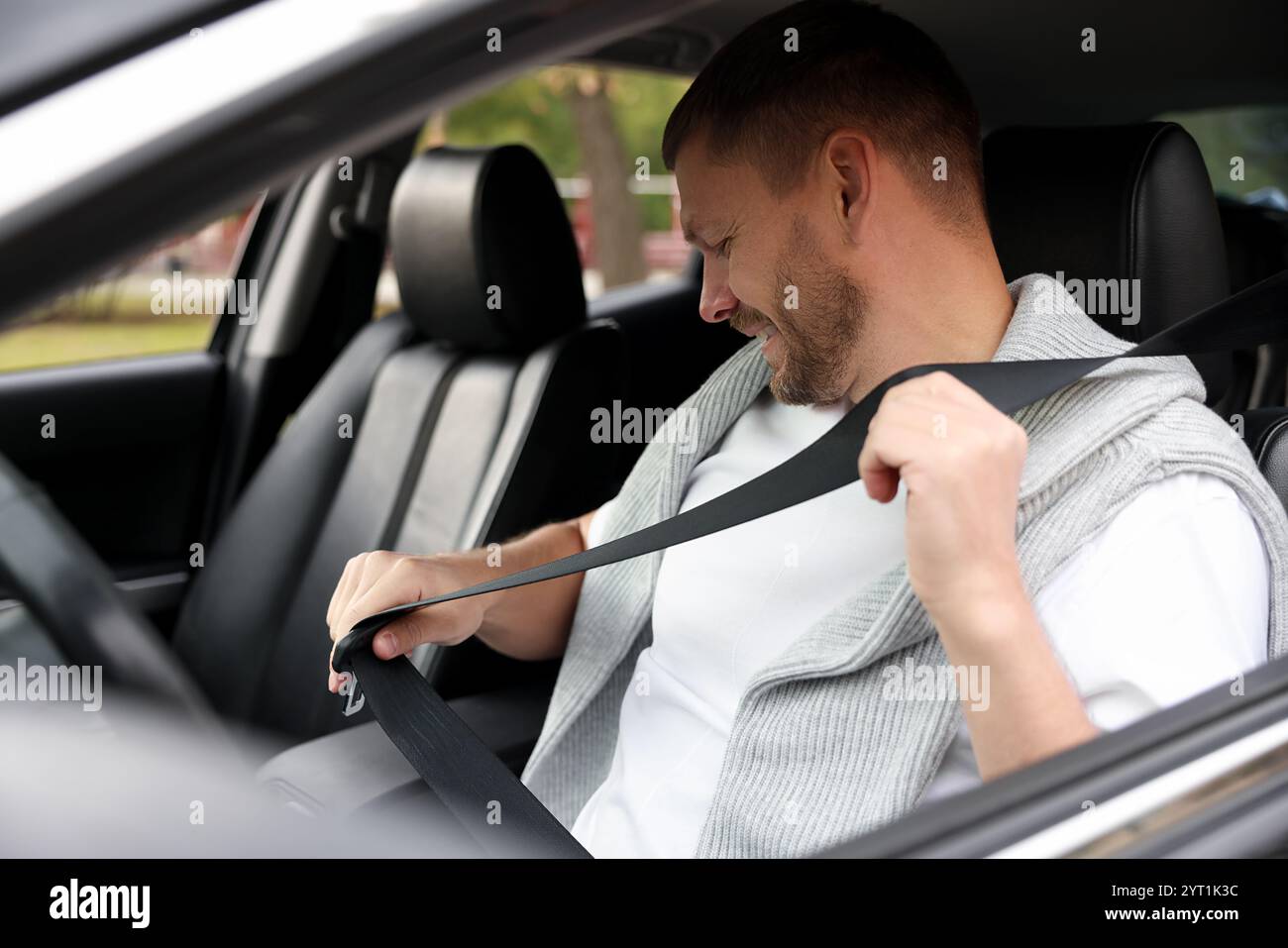 Man driving modern car, view through window Stock Photo - Alamy