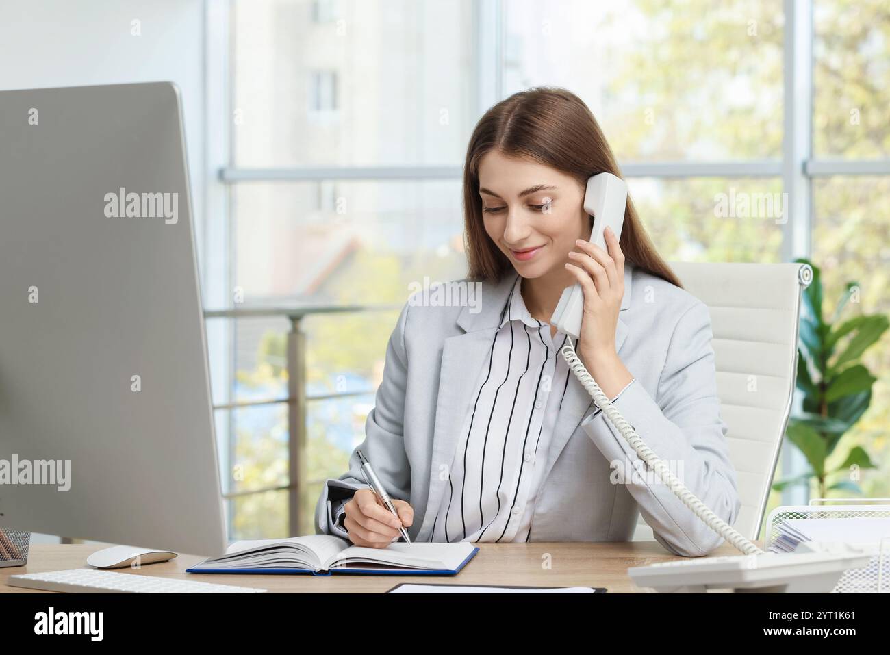 Money manager on telephone hi-res stock photography and images - Alamy