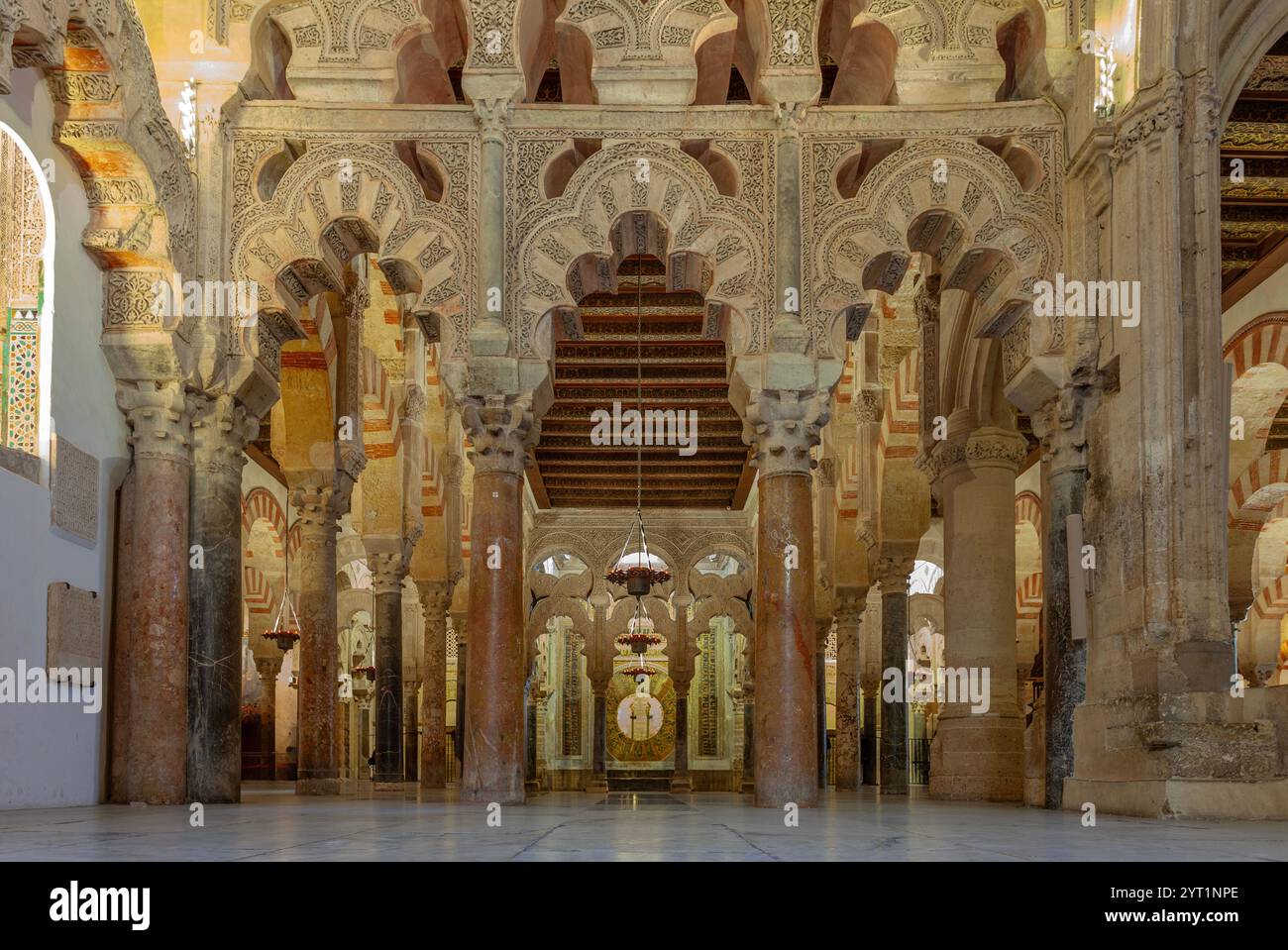 Double red and white arches on ancient Roman columns at the Mosque ...