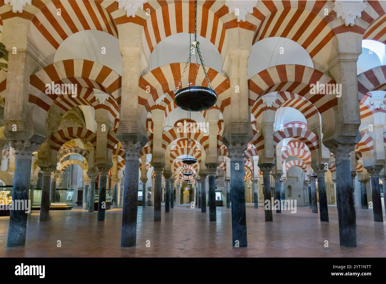 Double red and white arches on ancient Roman columns at the Mosque ...
