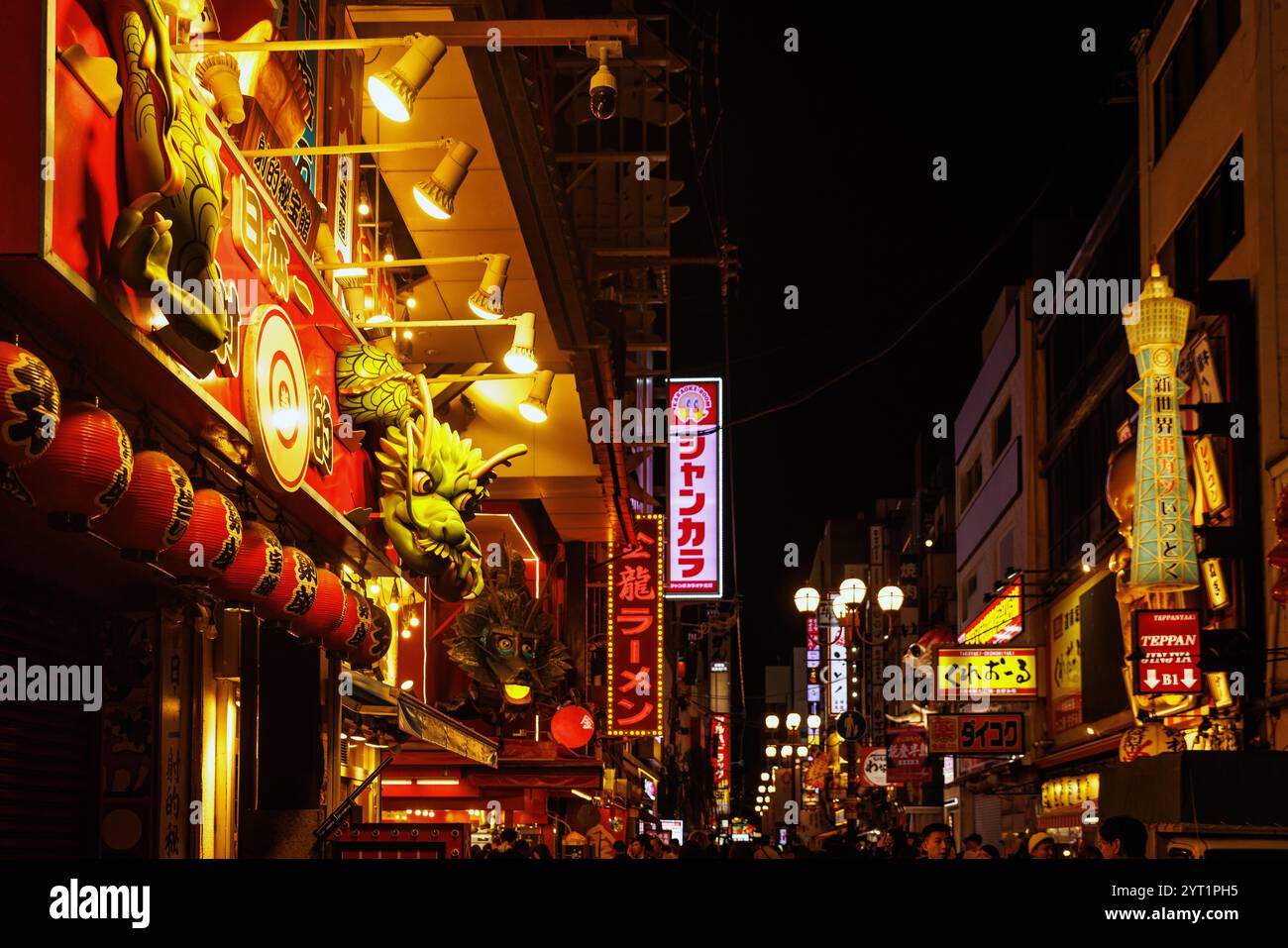 A vibrant and bustling night street scene filled with dazzling neon ...